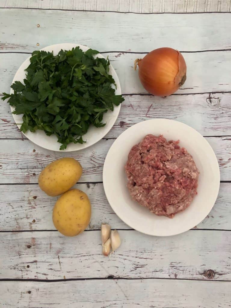 Kiftah bi Tahini Sauce Meatballs - Palestine In A Dish